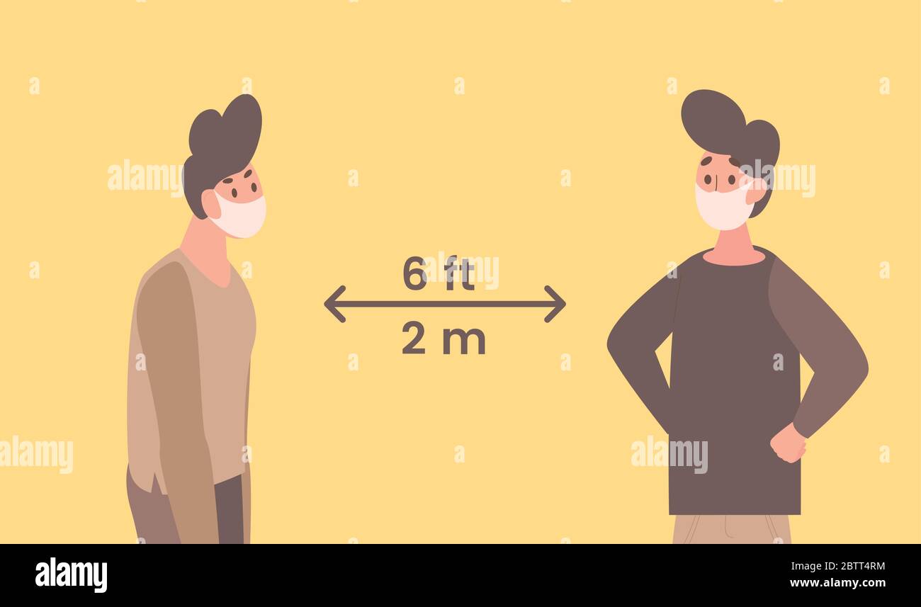 Two young men in medical face masks keep safe social distance in public ...