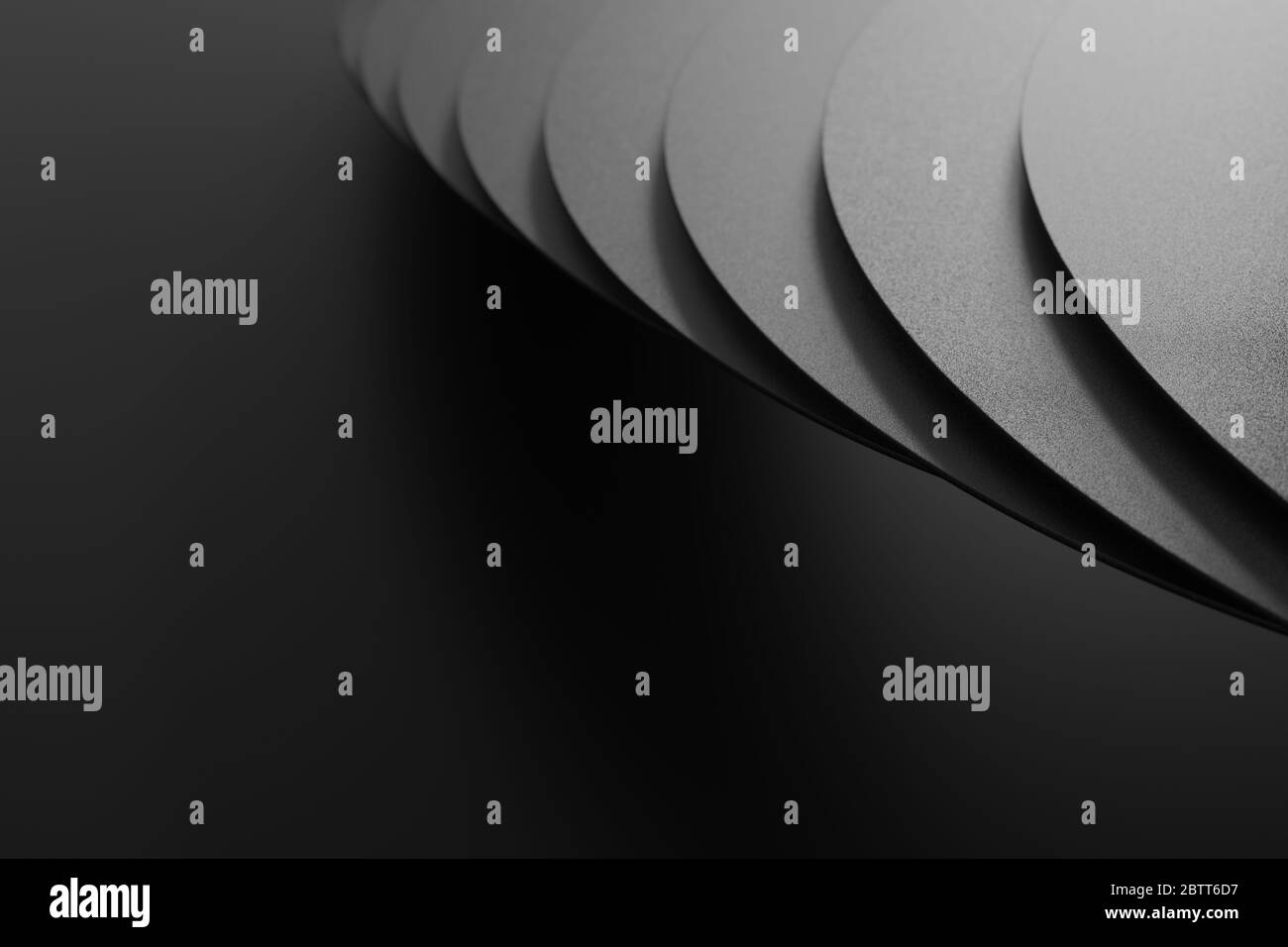 3D rendering of black stacked circles on black matte surface Stock ...