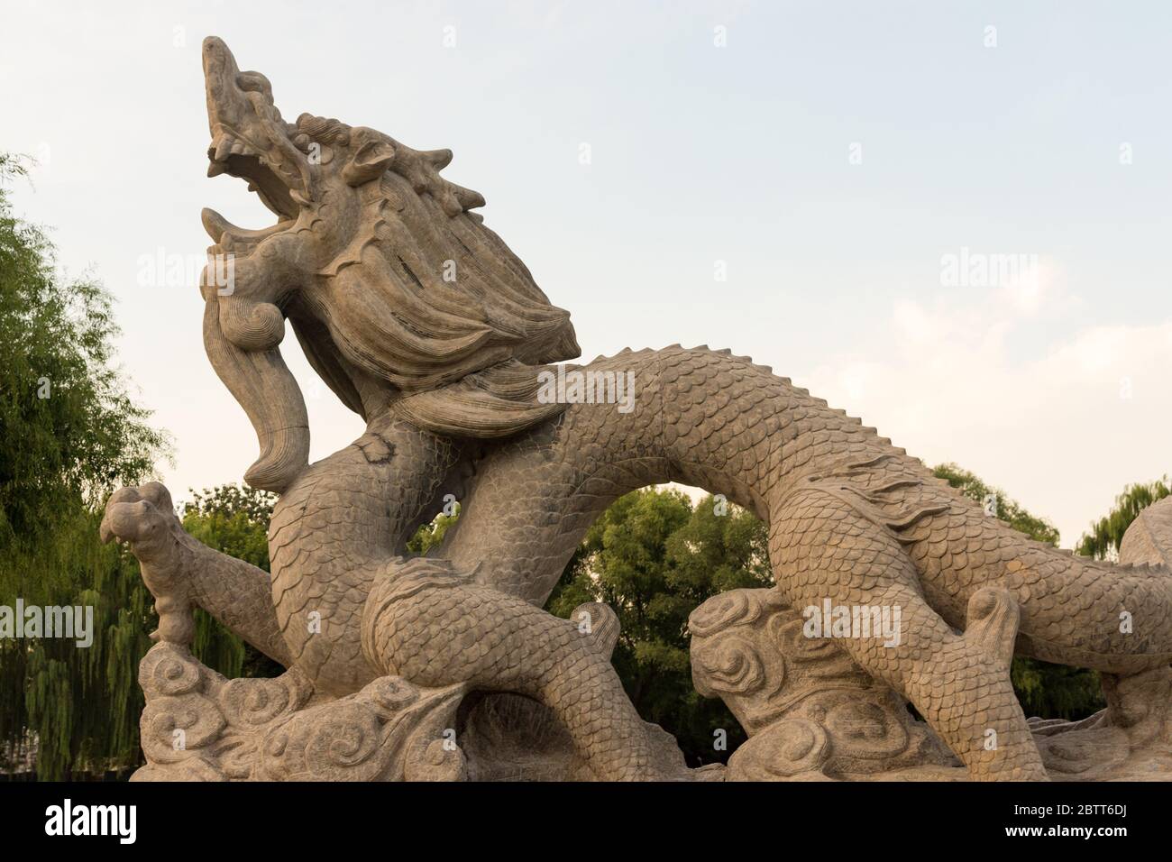 Sculpture of dragon carved in stone in Longtan Park (Pool of the Dragon ...