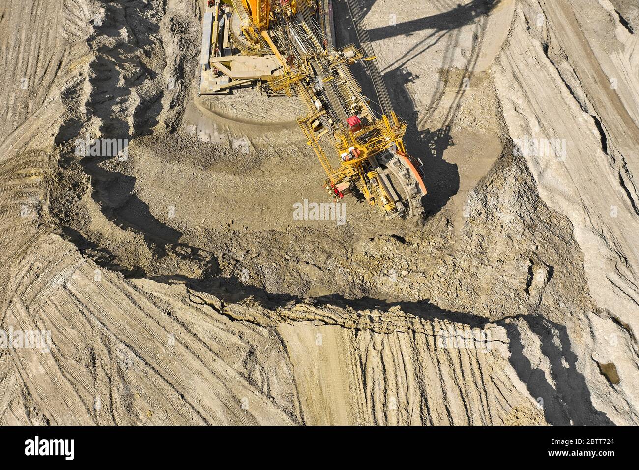 Aerial view of large heavy equipment machine mining natural resource ...
