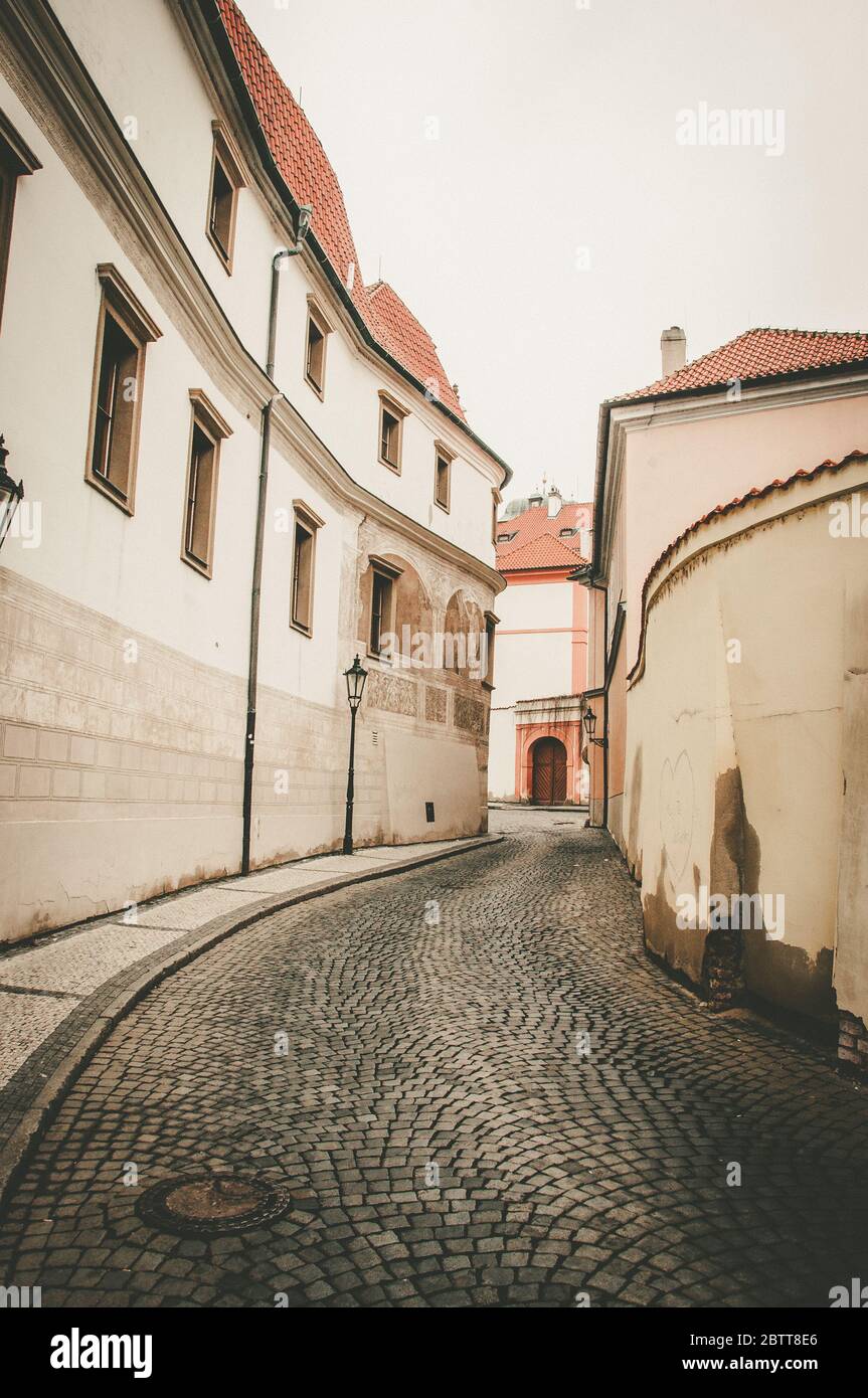 Narrow old street in the old part of the city Stock Photo - Alamy