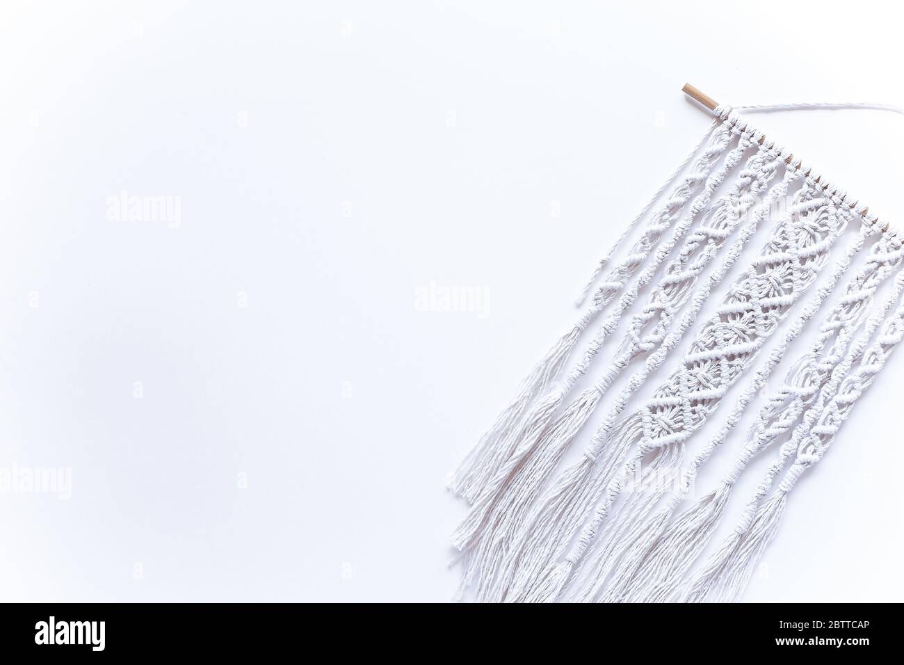 handmade macrame on white background, place for text,, copy space ...
