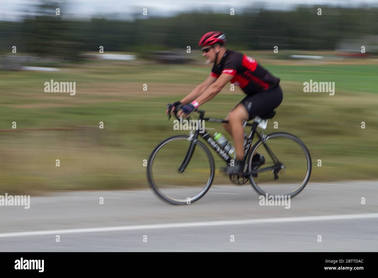 Scenic Bike Race, single rider, in full racing gear and uniform Stock ...