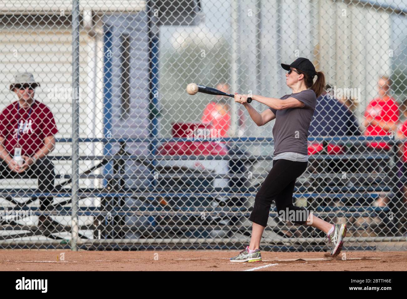 Playing in a mixed slo pitch softball game, with females at bat Stock ...