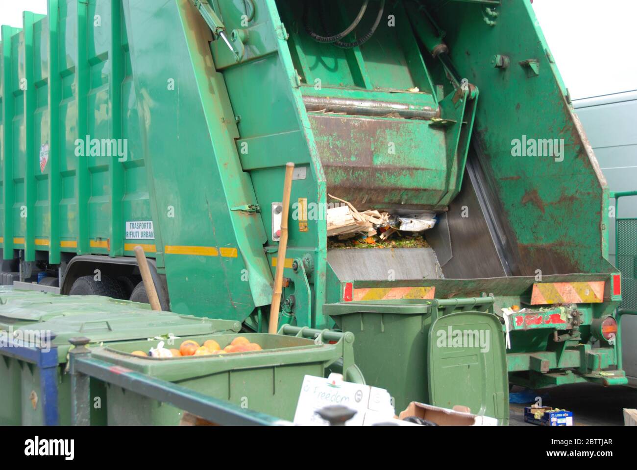 Bins with waste with food waste at the market Stock Photo - Alamy