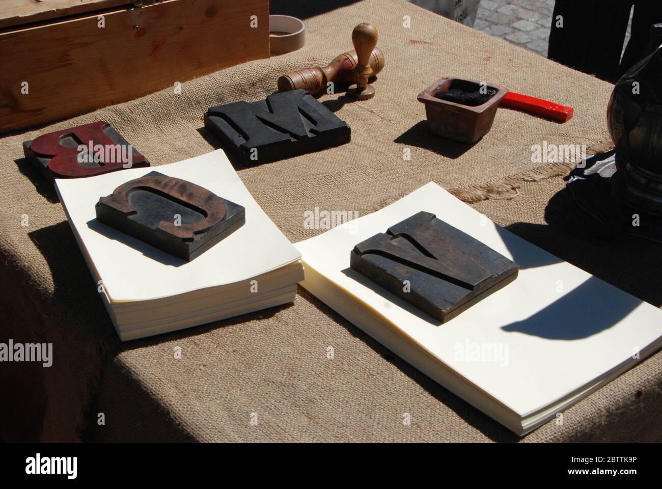 Table with stamps and printing with movable typefaces Stock Photo - Alamy