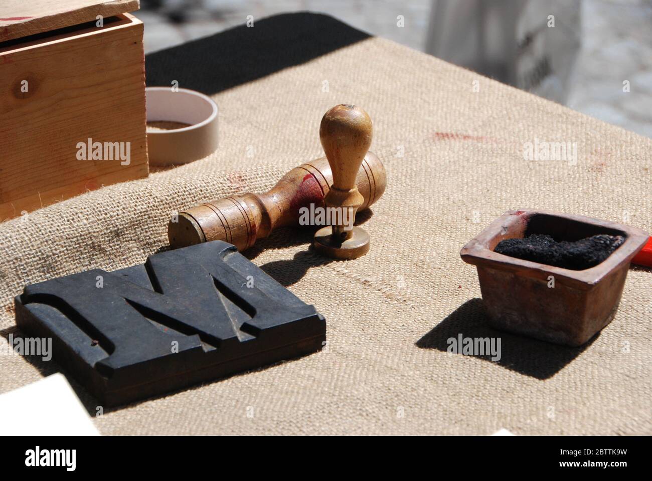 Table with stamps and printing with movable typefaces Stock Photo - Alamy