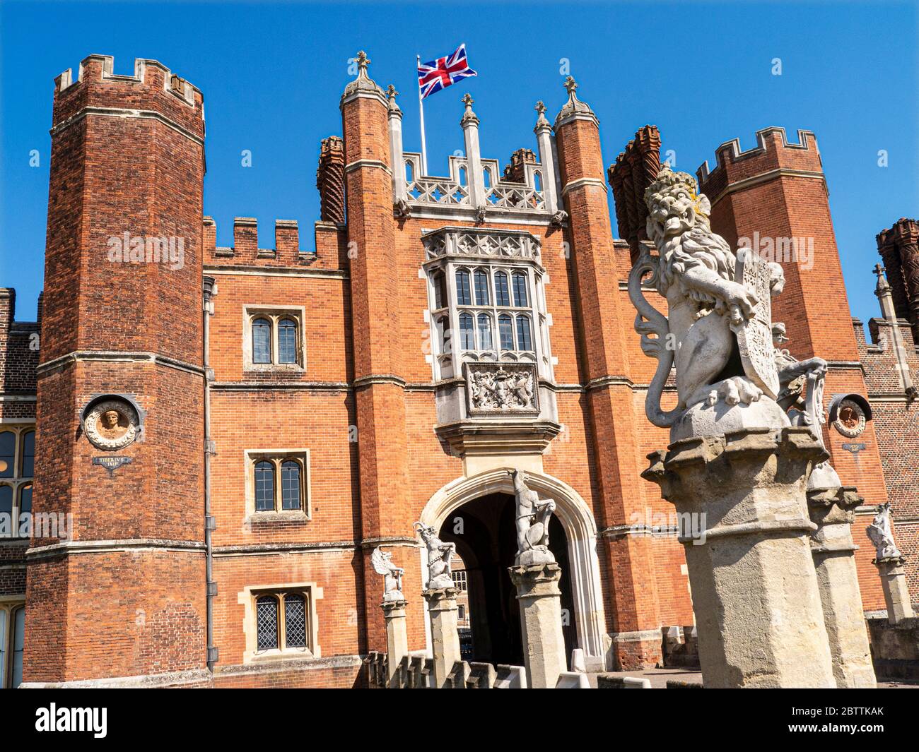 Hampton Court Palace entrance with Union Jack Flag flying, a royal ...