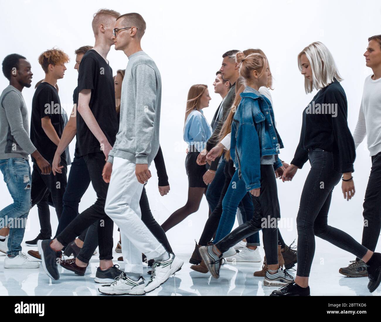casual young people walking in different directions Stock Photo - Alamy