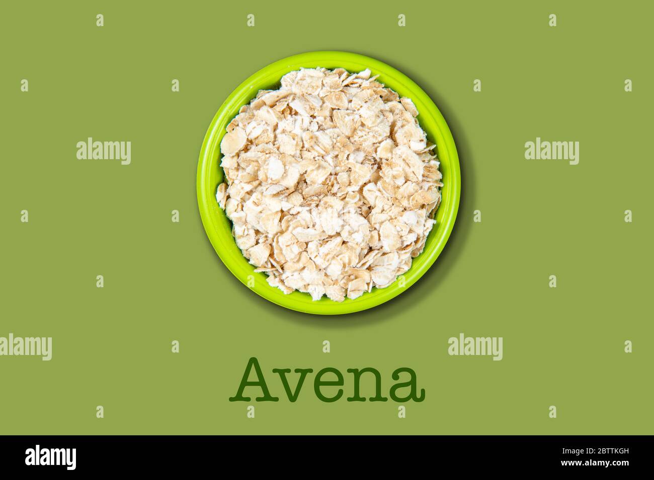 Green Bowl with culinary ingredients Oats (text in Spanish) on dark ...