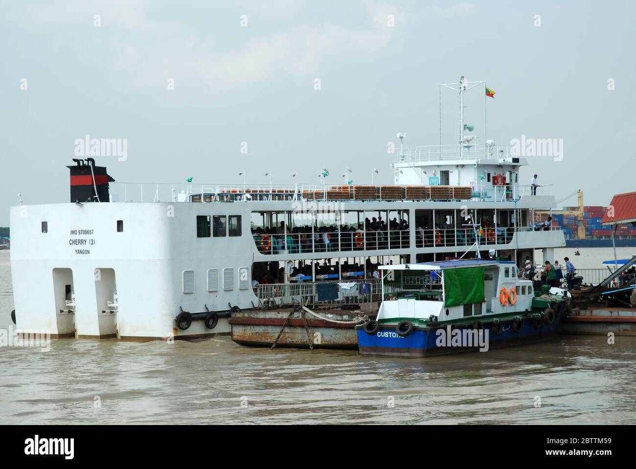 A passenger ferry arriving at Pansodan Ferry Terminal from Dala after a ...