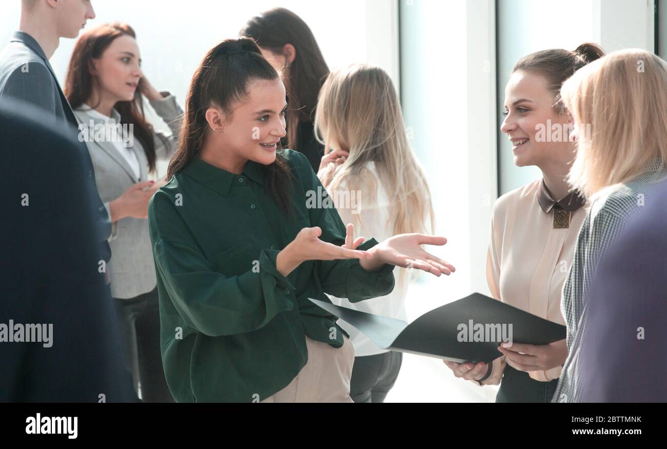 colleagues discuss documents before starting an office meeting Stock ...