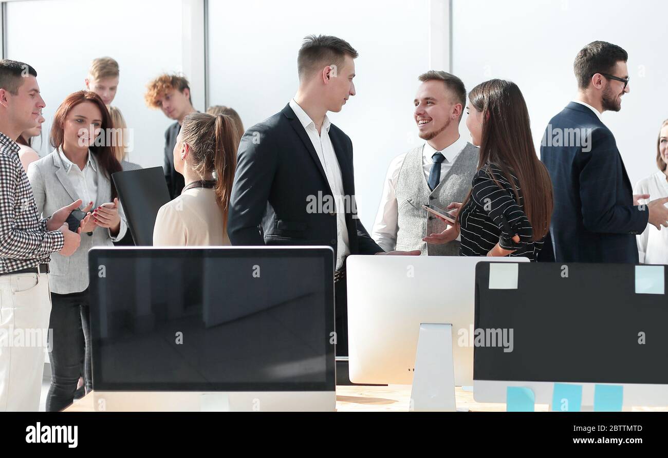 group of young employees discussing work issues Stock Photo - Alamy