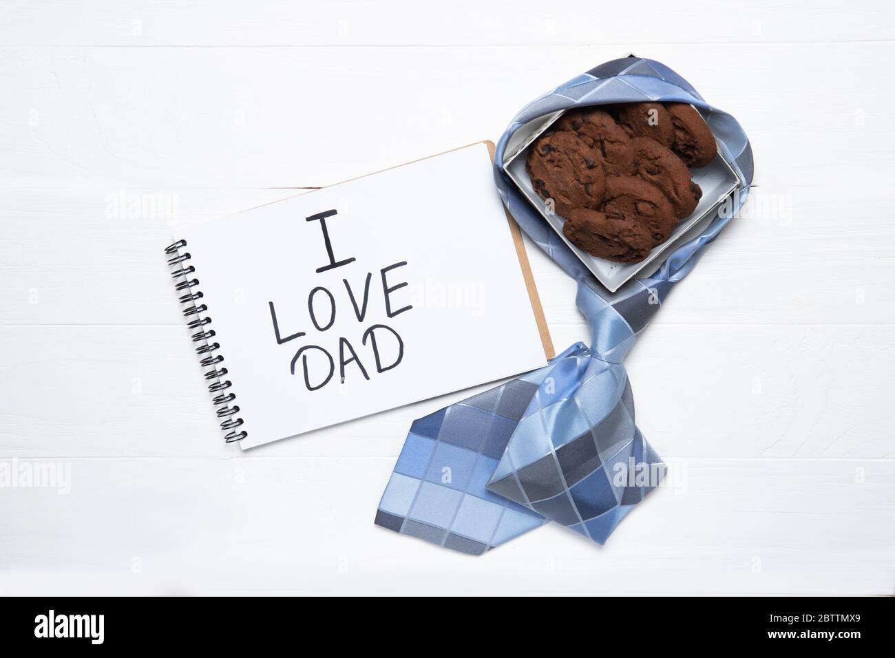 Notepad with text i love dad and a box with cookies. Daddy's Day ...