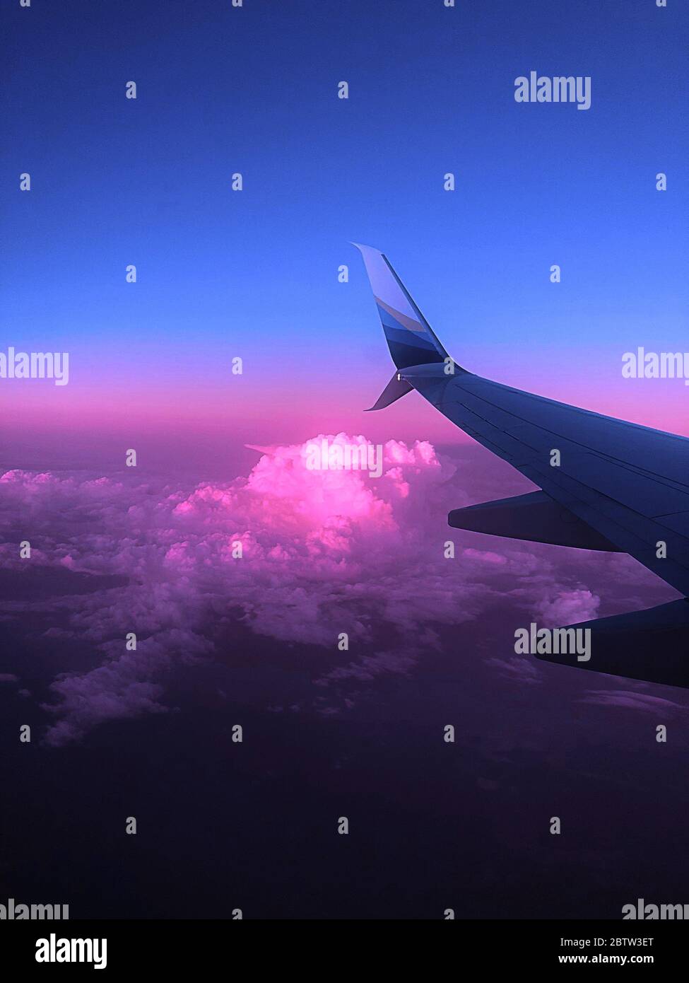 Beautiful pink sky from the window of the plane Stock Photo - Alamy