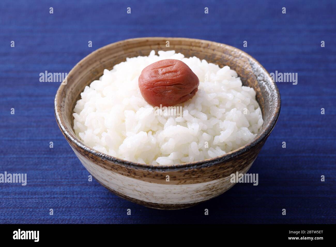 Japanese food, Umeboshi pickled salt plum on white rice in a bowl Stock ...