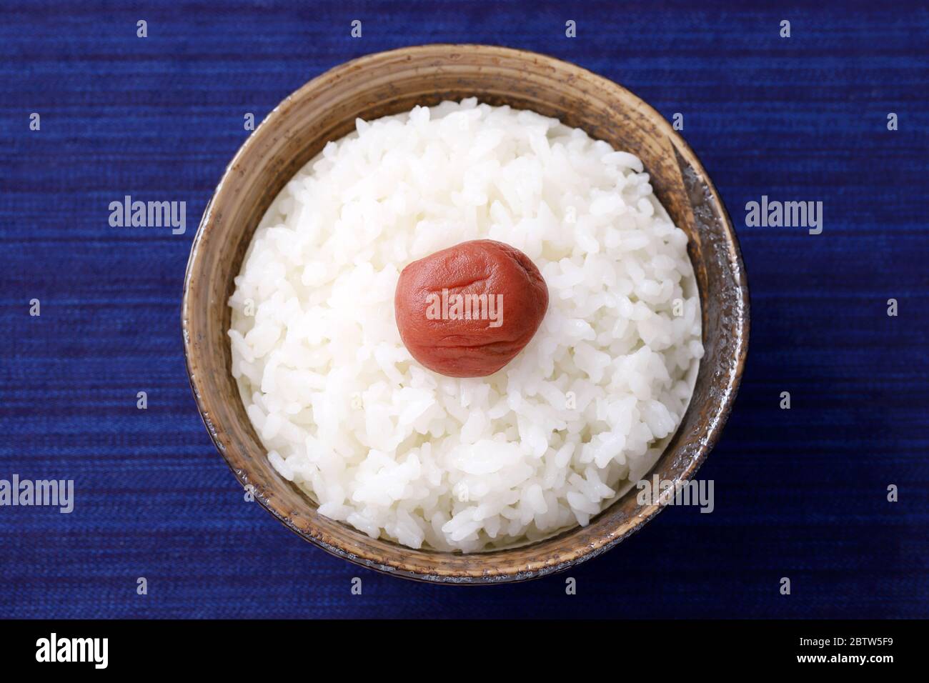 Japanese food, Umeboshi pickled salt plum on white rice in a bowl Stock ...