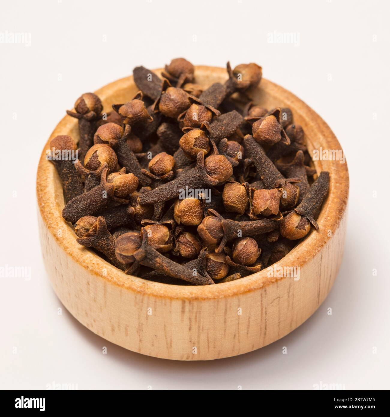 Closu-up view of dried cloves on white background Stock Photo - Alamy