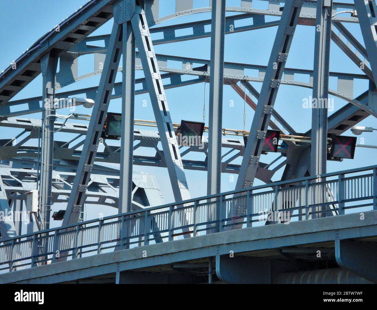Iron bridges across the river and traffic lights, red green arrows on ...