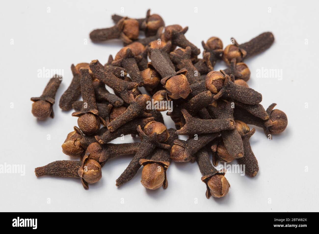 Closu-up view of dried cloves on white background Stock Photo - Alamy