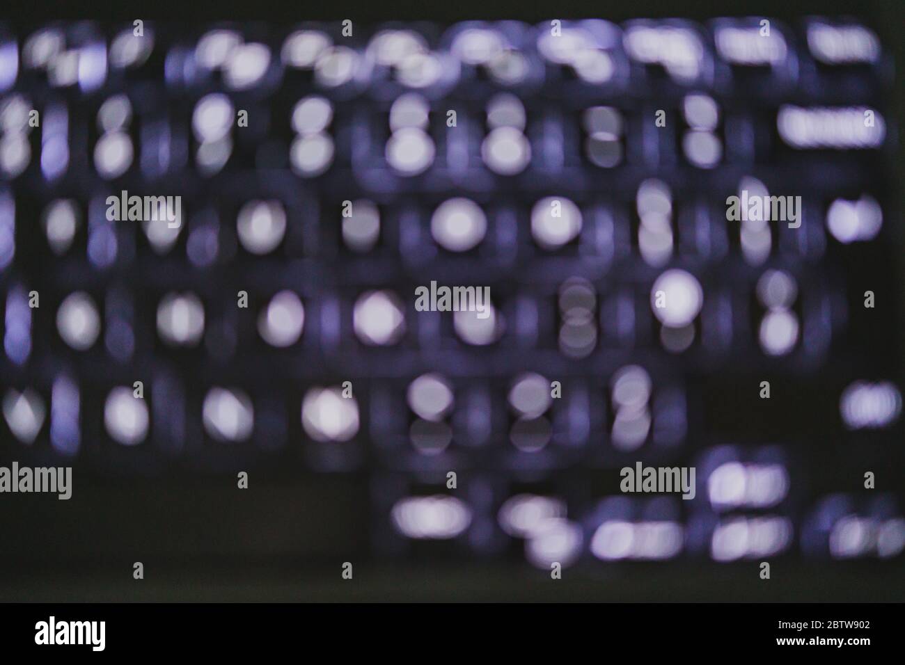blurred background of backlit keyboard with led light Stock Photo - Alamy