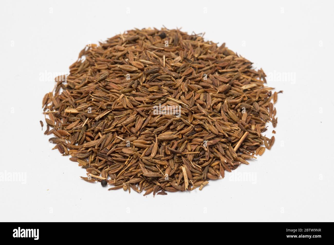 Cumin seeds on white background Stock Photo - Alamy