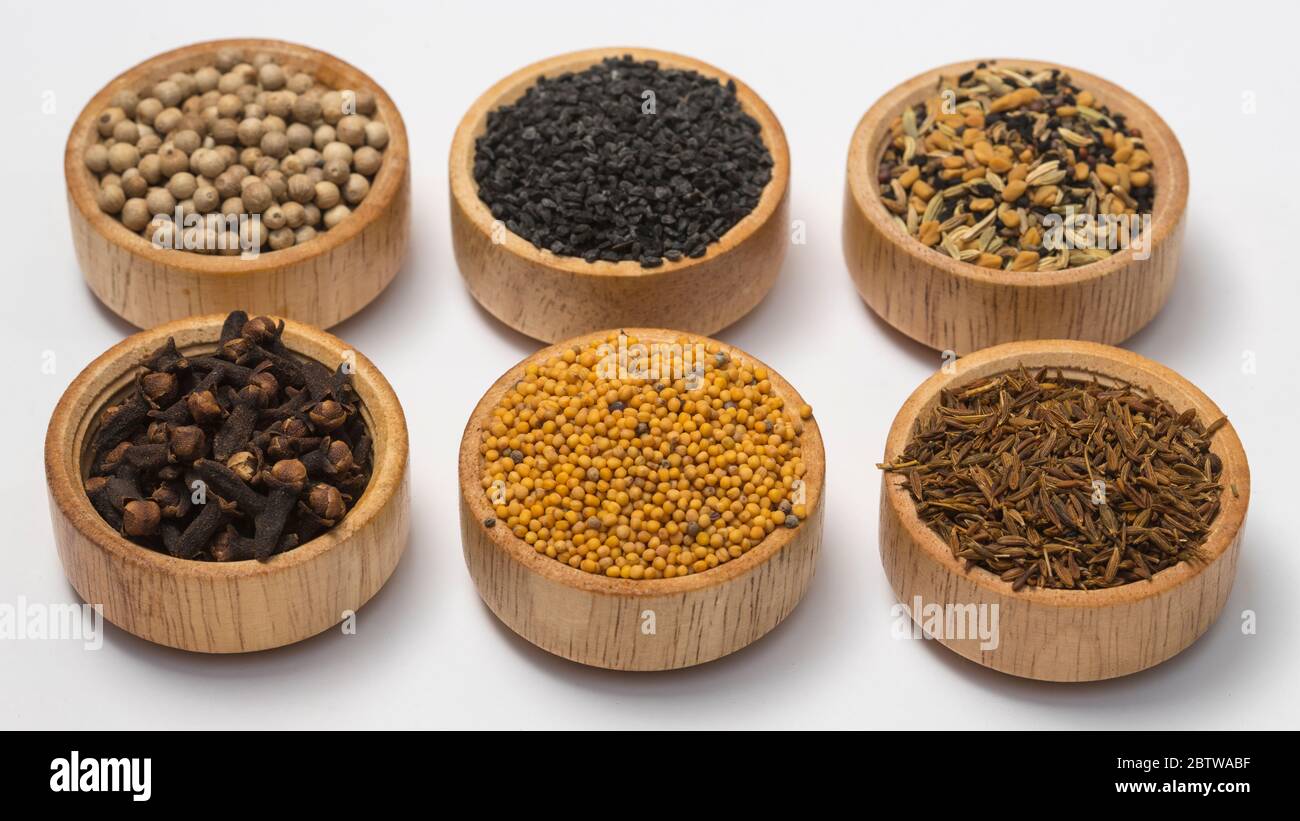 Different type of spices in small wooden bowls on white Background ...