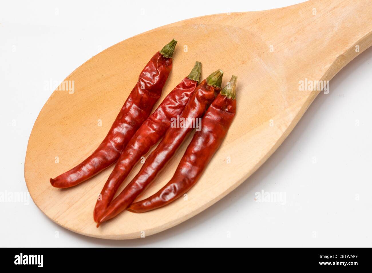 Red chili in wooden spoon hi-res stock photography and images - Alamy