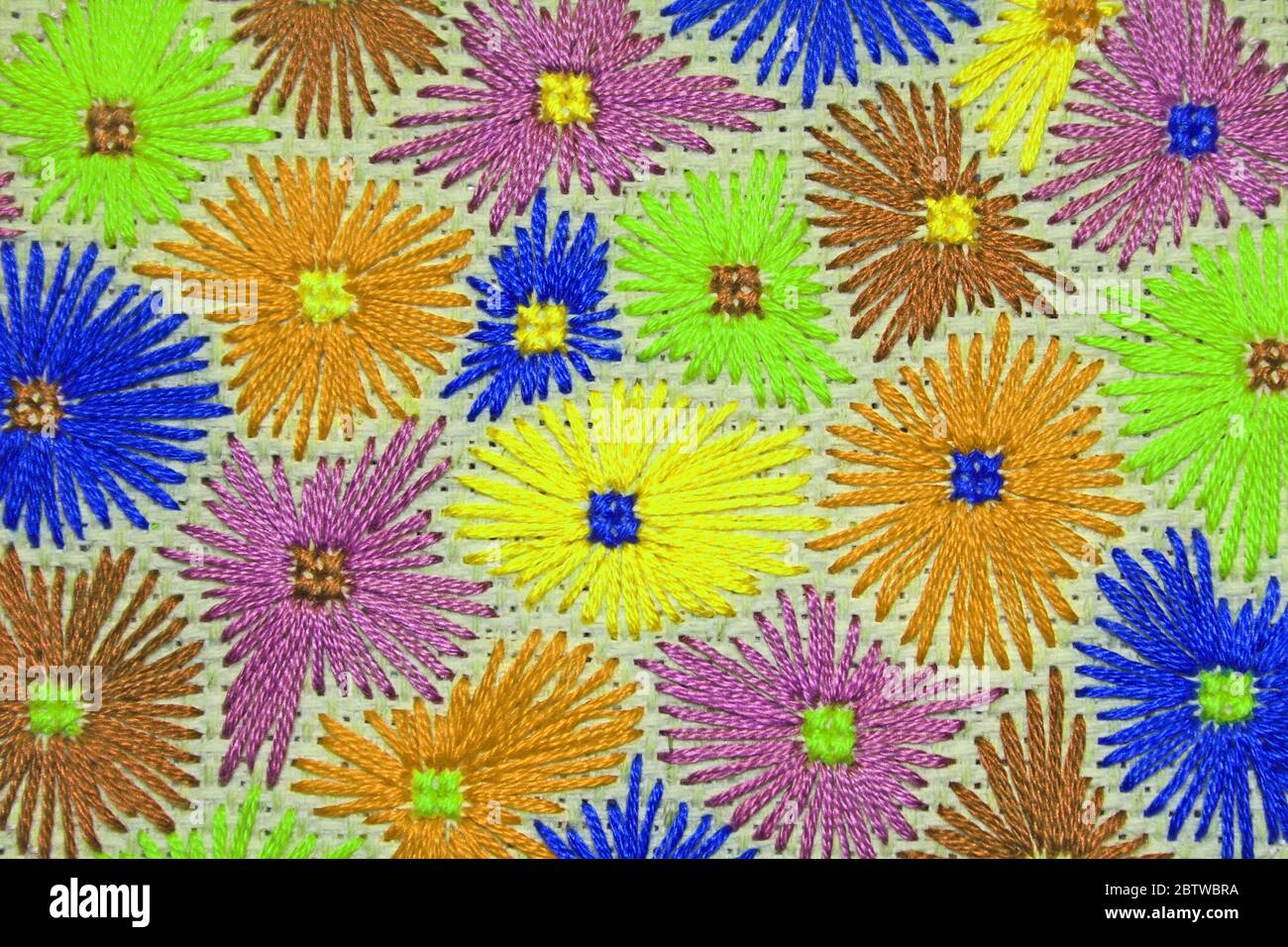 Embroidered flowers in cold colors Stock Photo - Alamy