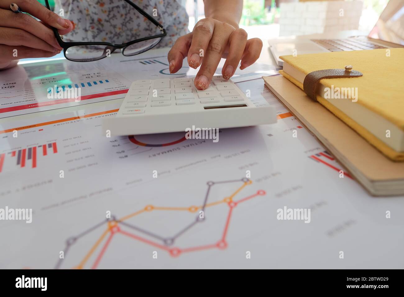 Typing with pencil on calculator hi-res stock photography and images ...