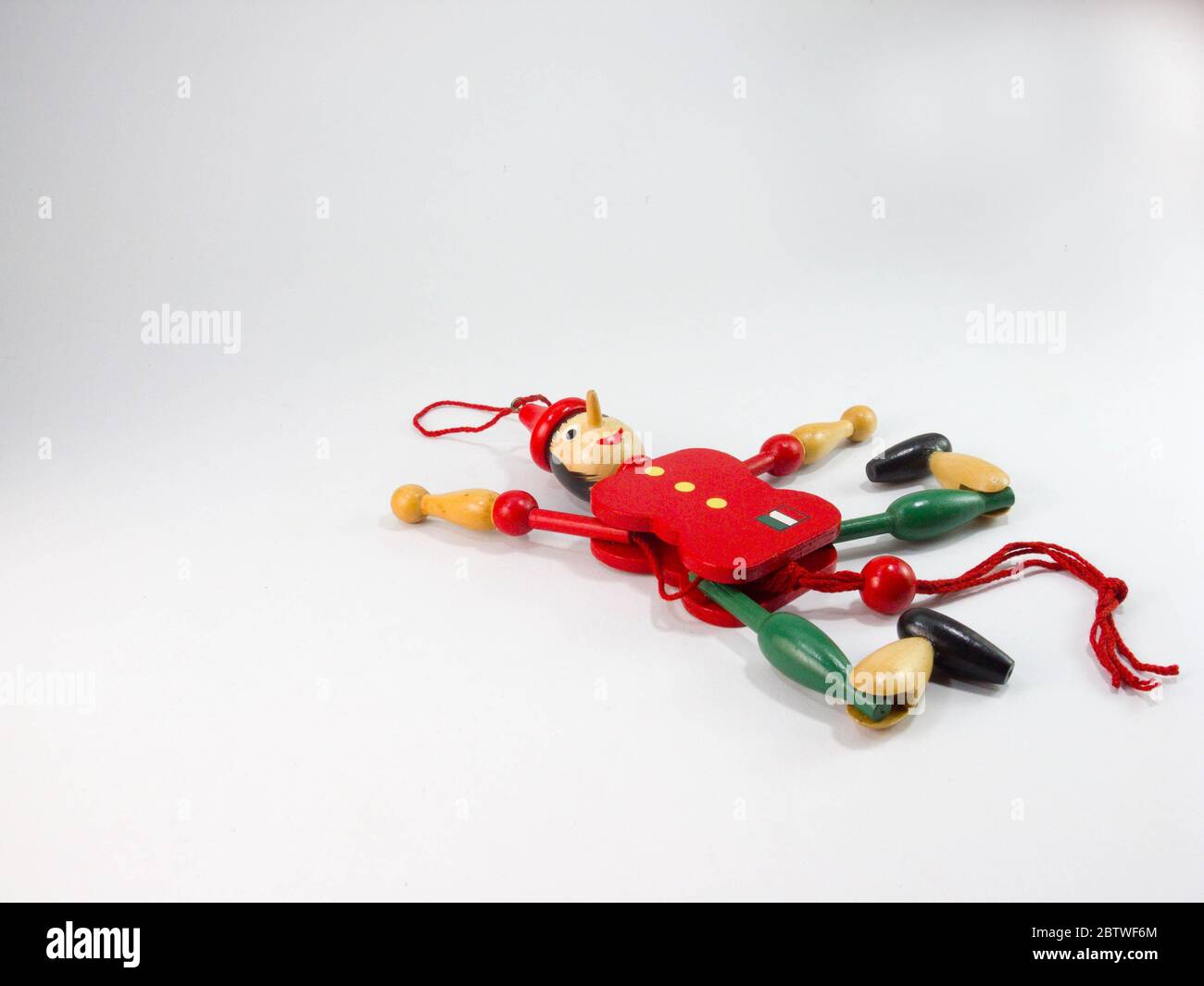 puppet Old wood Green and red puppet dolls On a white background Stock ...