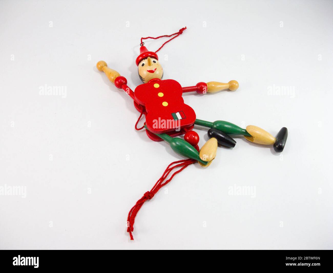 puppet Old wood Green and red puppet dolls On a white background Stock ...
