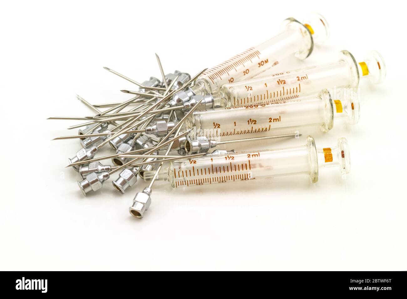 Stack of reuse iron needle No.18 G for drug needle and glass syringe on ...