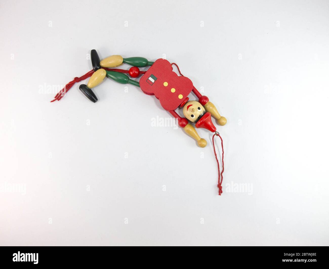 puppet Old wood Green and red puppet dolls On a white background Stock ...