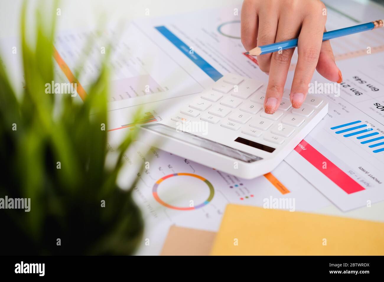 Close up Accountants use calculator analysis financial Stock Photo - Alamy