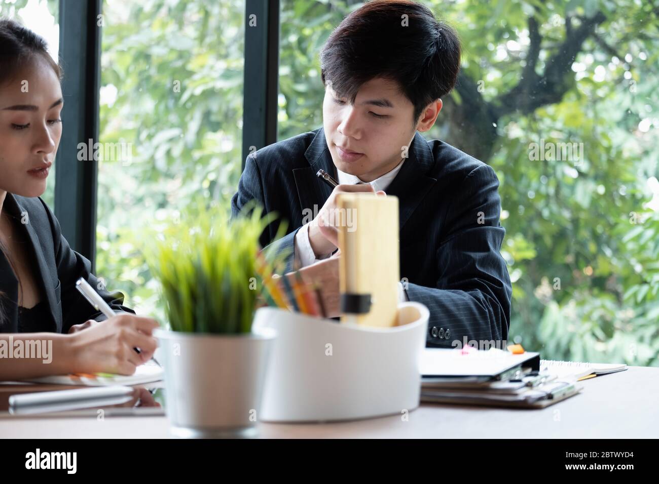 Young Business Asian are Meeting Design Ideas Concept. business ...