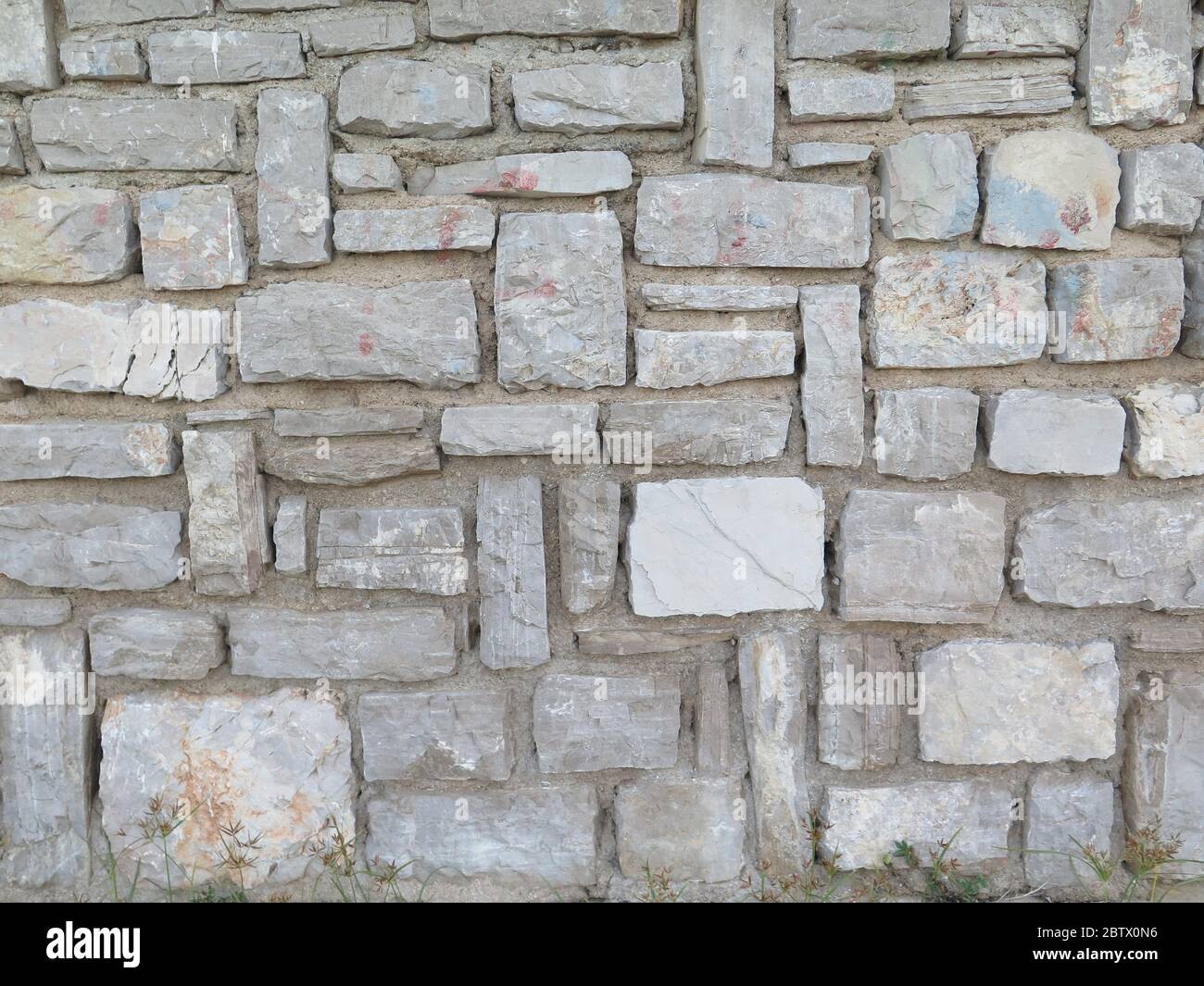 Closeup of grey rectangular Italian style Stone Block wall Stock Photo ...