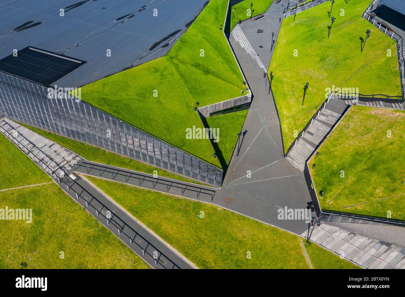 Katowice city center architecture. Aerial view of green grass terraces ...