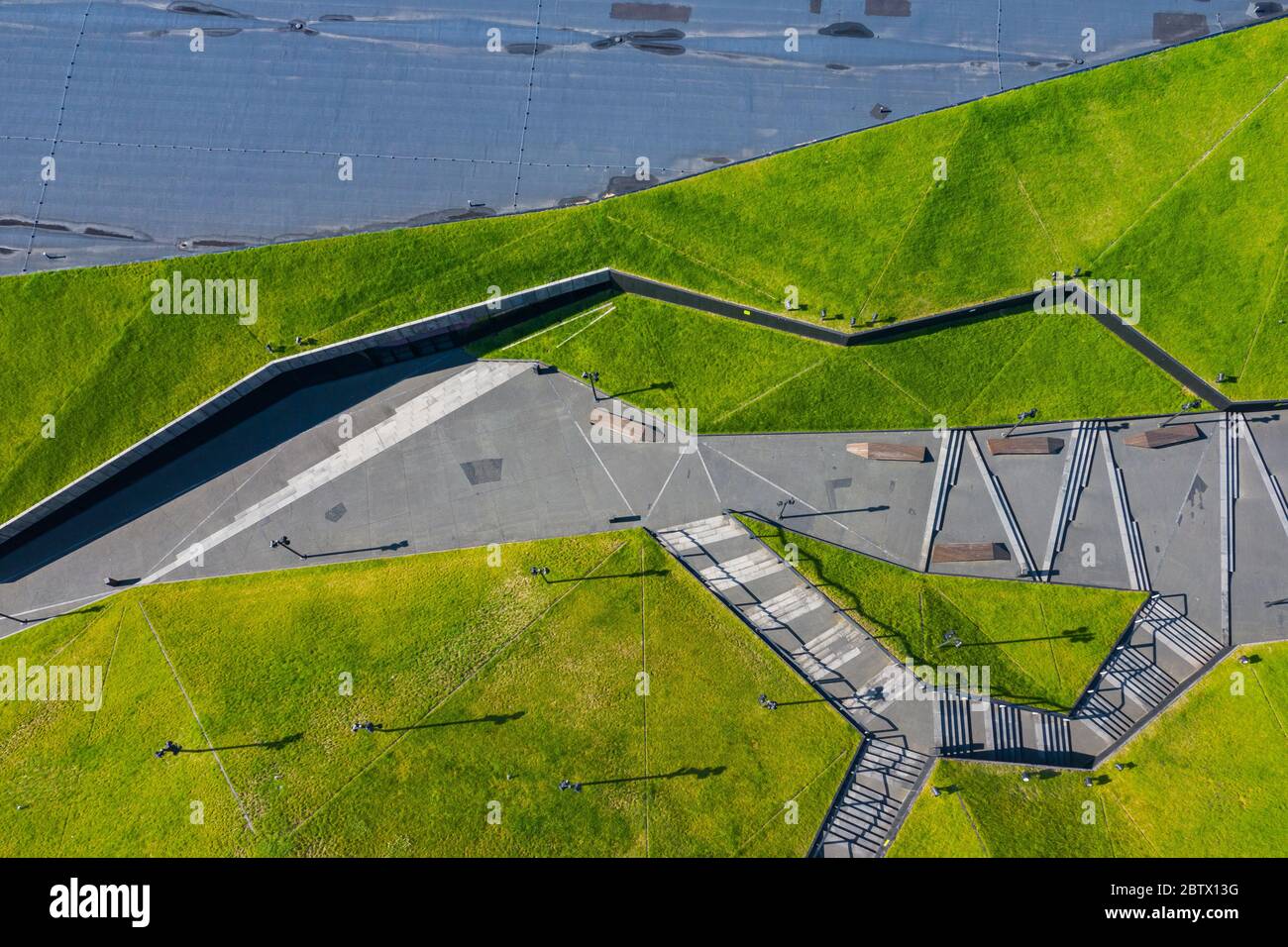 Katowice city center architecture. Aerial view of green grass terraces ...