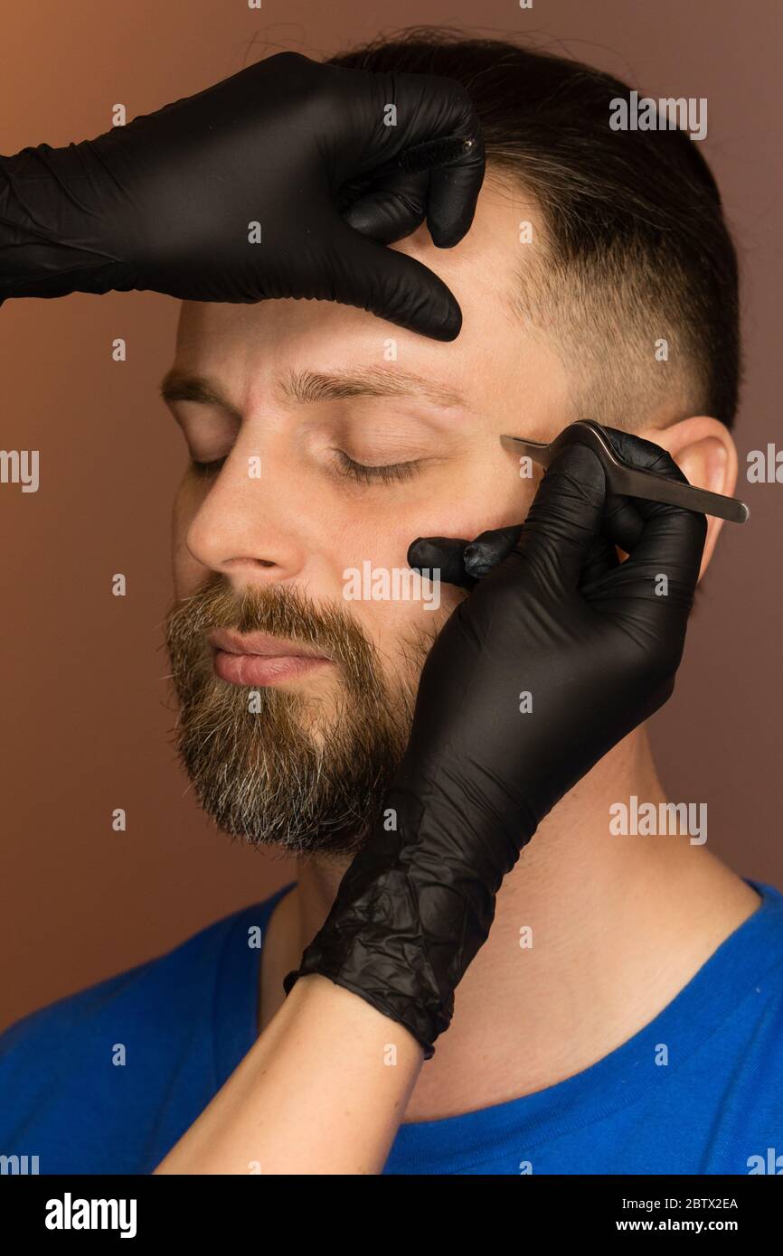 Eyebrow plucking male hi-res stock photography and images - Alamy