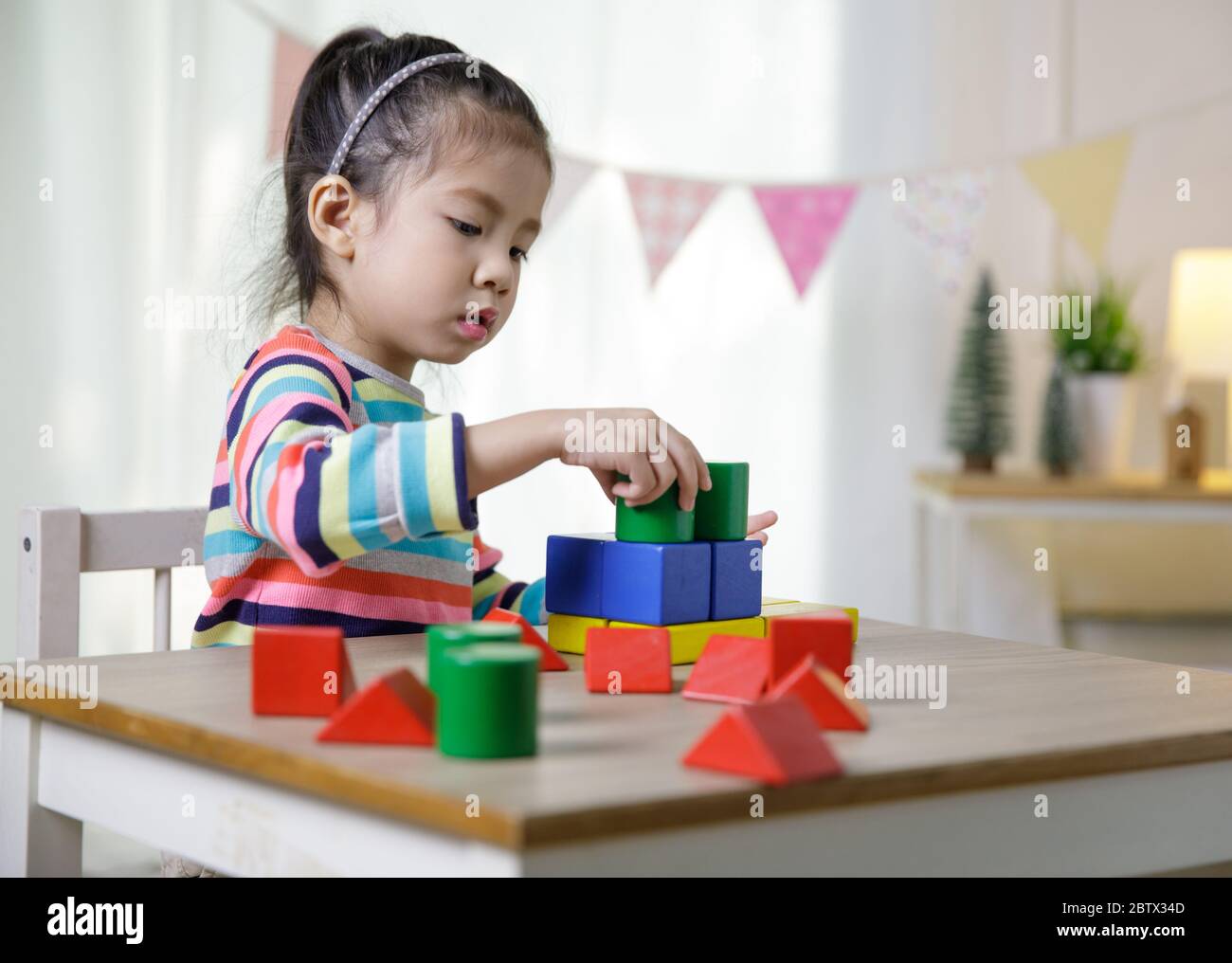 Kid's creativity, Child little asian girl playing colorful building ...