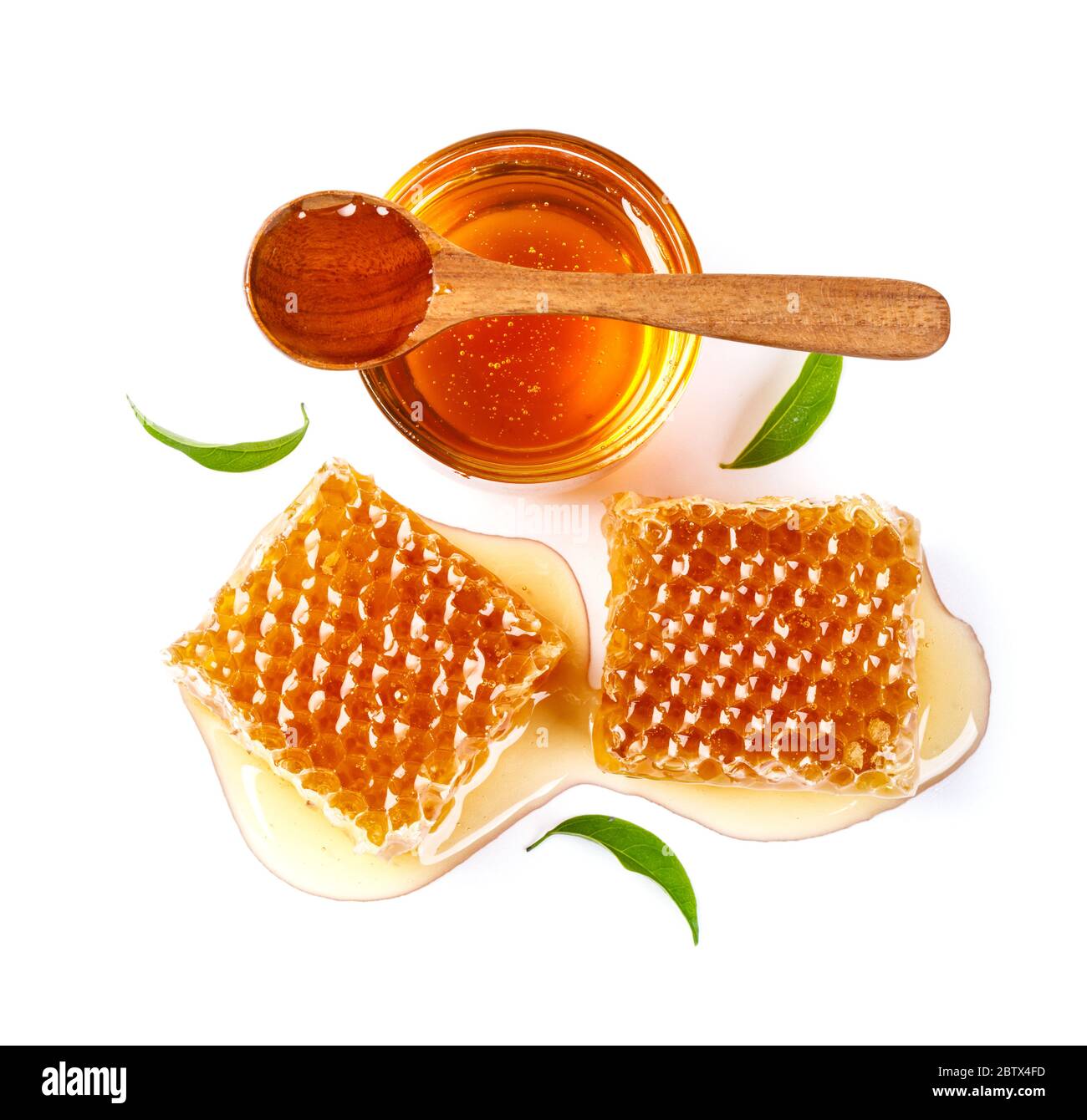Honeycomb with jar and honey spoon and leaf isolated on white ...