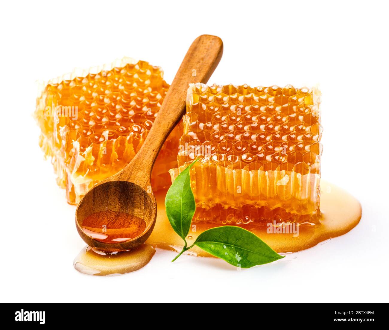 Honeycomb with honey spoon and leaf isolated on white background Stock ...