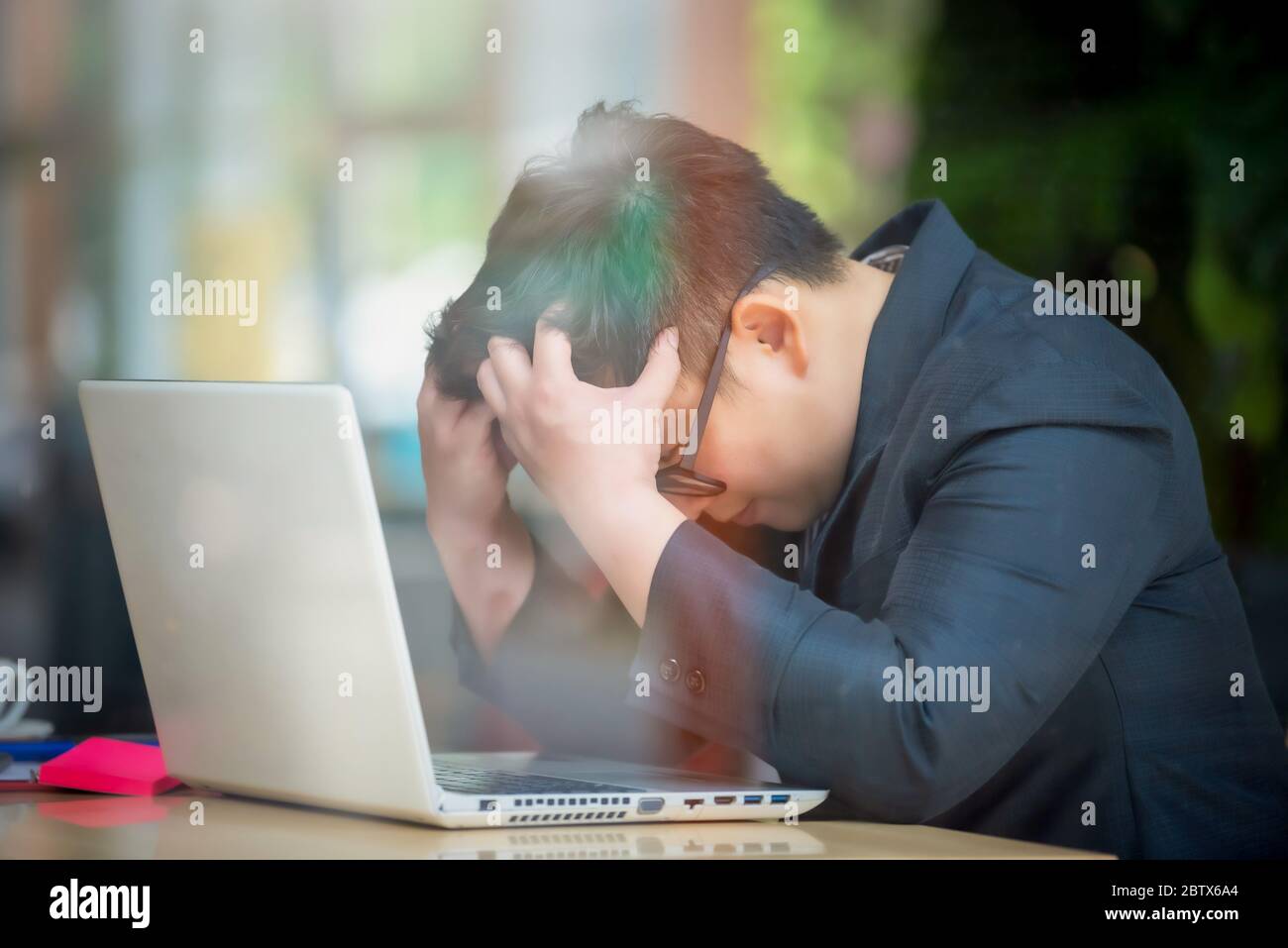 Sad businessman stressed and worried sitting in office. Stress and ...
