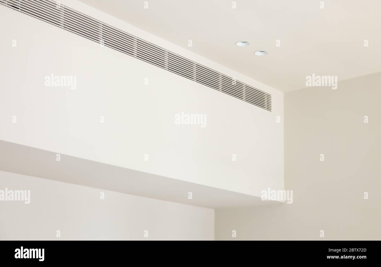 Plaster ceiling with grating the air conditioner Stock Photo - Alamy