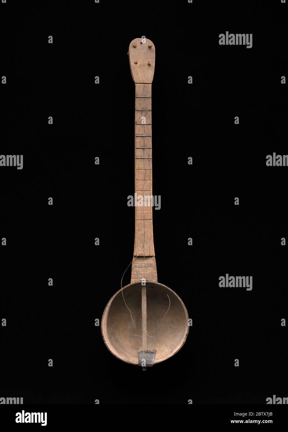 Gourd head banjo. This gourd banjo illustrates an earlier style of ...