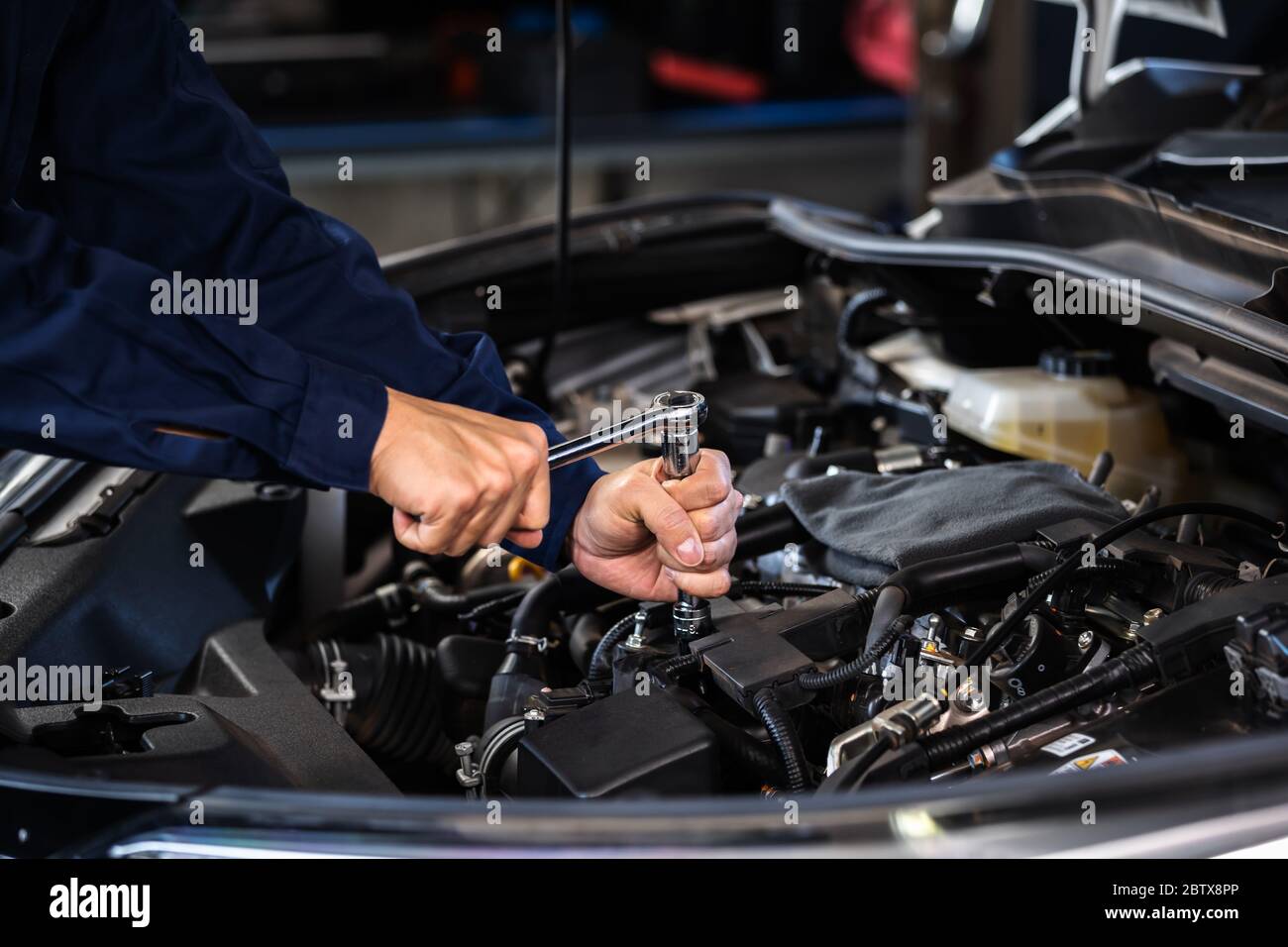mechanic hand using wrench to repair the engine, car service Stock ...