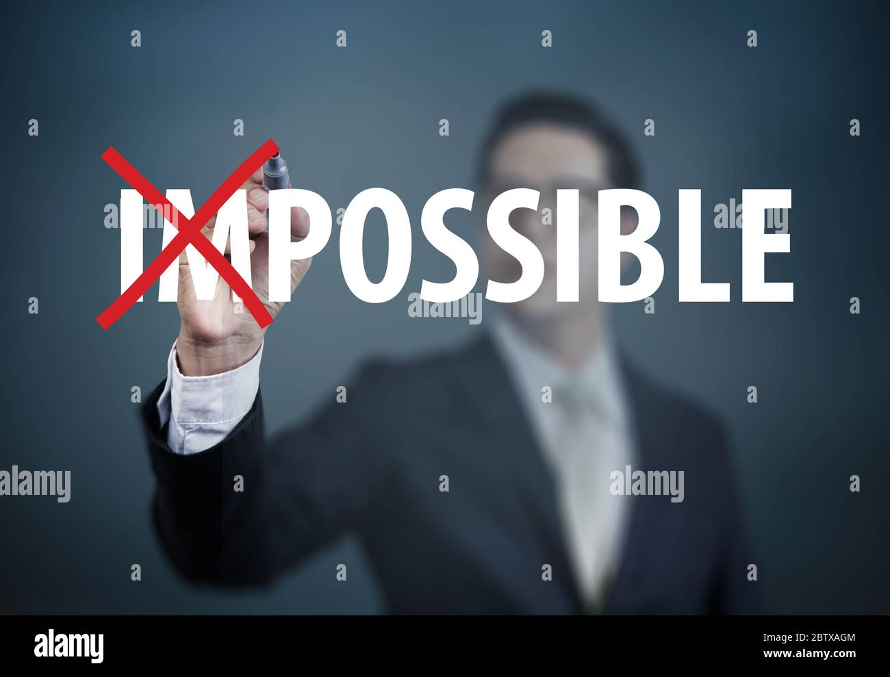 Businessman hand Changing the word "impossible to possible" with red ...
