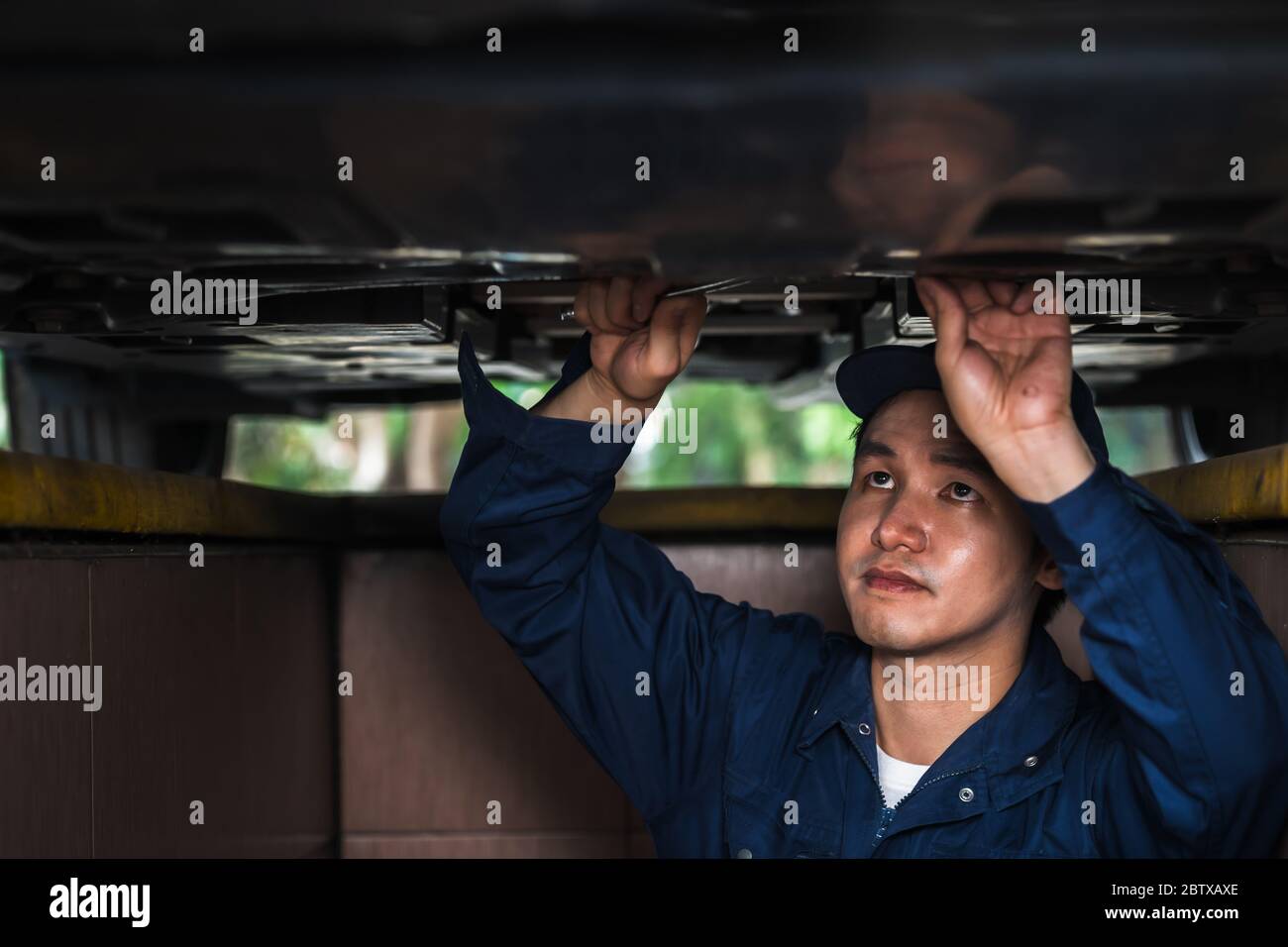 Professional auto mechanic using wrench hi-res stock photography and ...