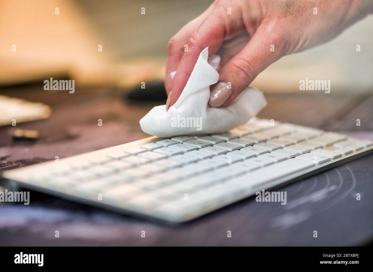 Woman hand cleaning computer keyboard, disinfecting room Stock Photo ...